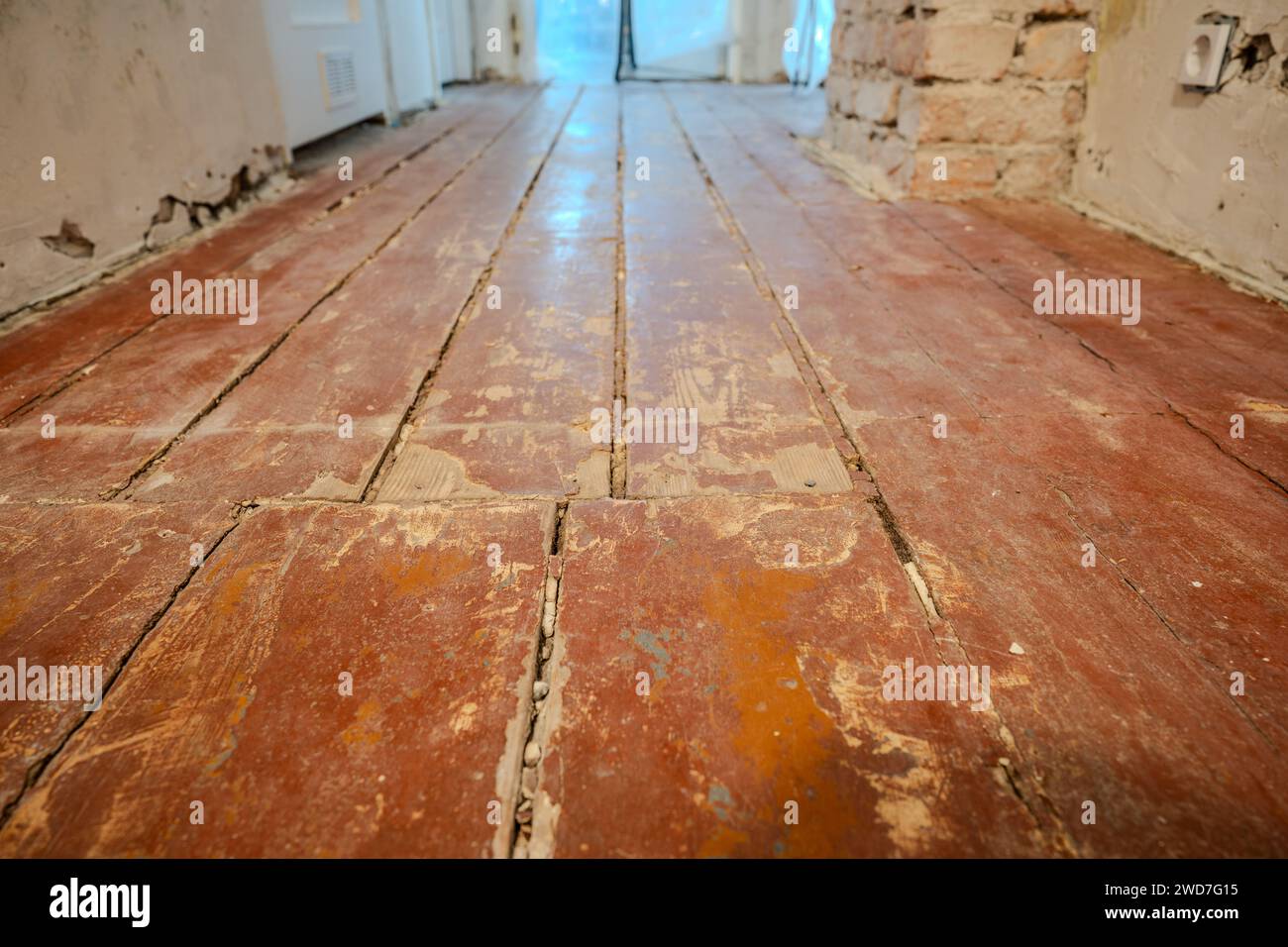 Old wooden floor repairing. Old planks on the floor. Close-up view ...