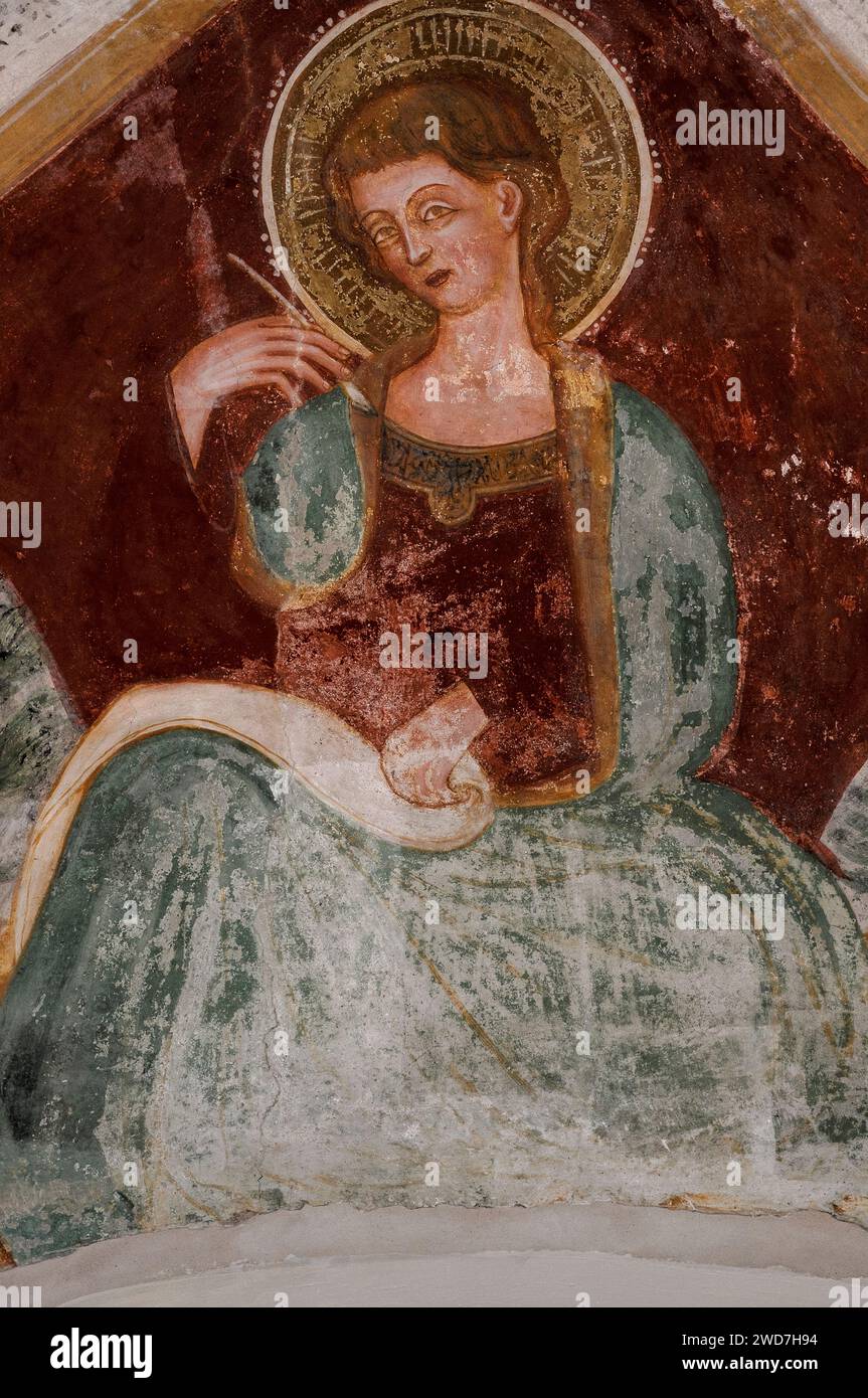 Saint John the Evangelist, pen poised. Gothic ceiling fresco from the ...