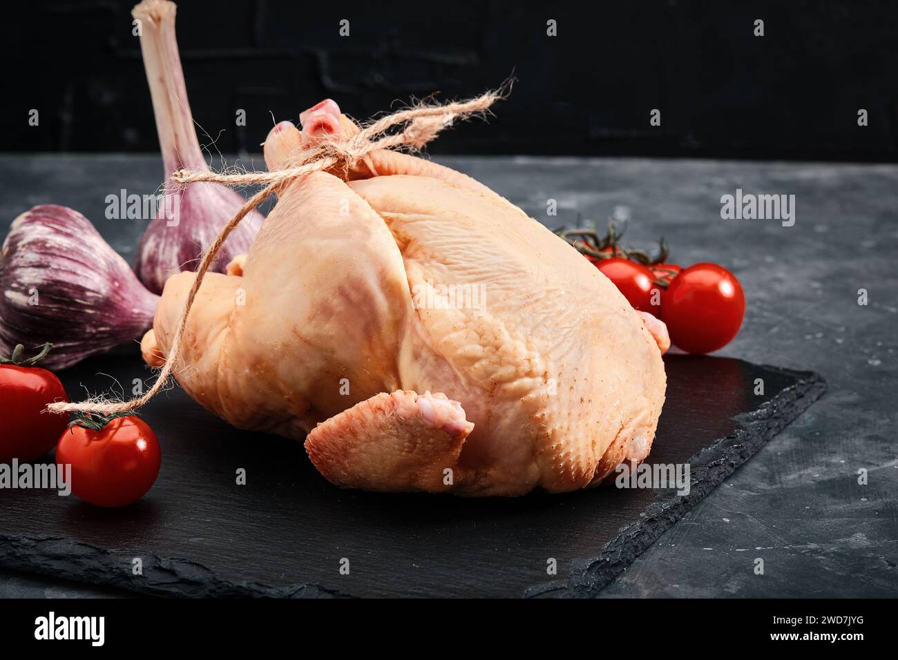 Fresh halal chicken carcass on a gray background, fresh meat, copy ...