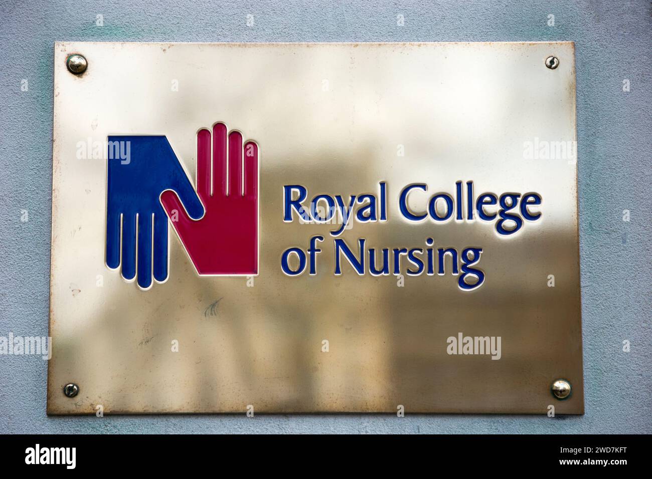 Brass name plate / plaque outside the offices of / on office ...