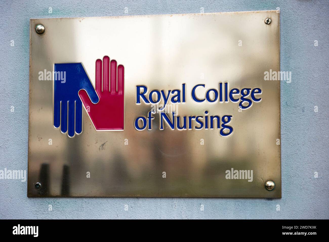 Brass name plate / plaque outside the offices of / on office ...