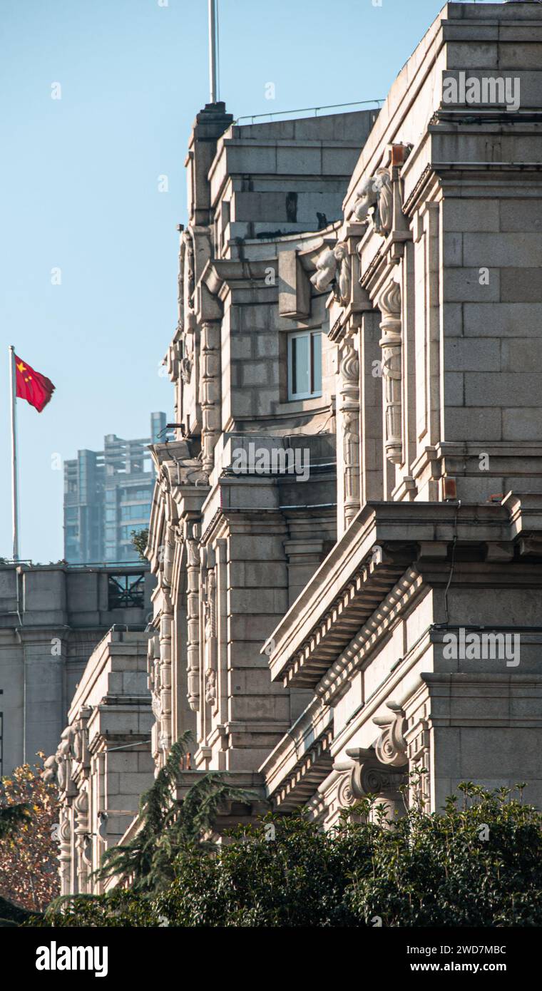 A majestic stone edifice with a flag gracefully waving on its facade ...