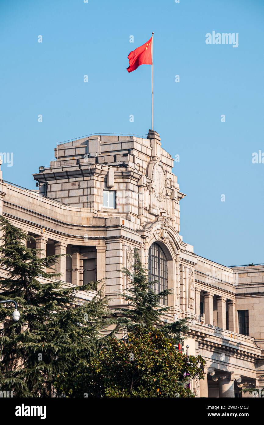 The government office building with a flag gracefully waving on its ...