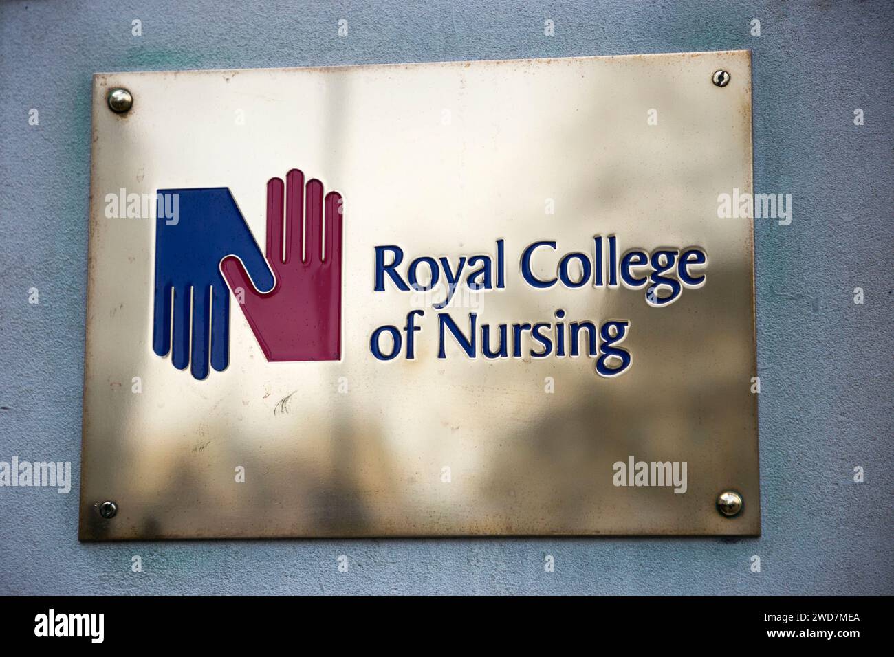 Brass name plate / plaque outside the offices of / on office ...