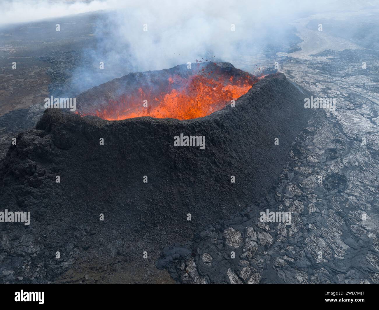 Volcano spewing lava on its first day of eruption Stock Photo - Alamy