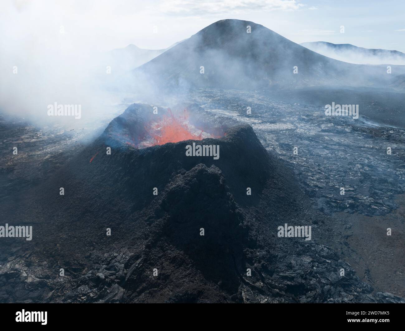 Volcano spewing lava on its first day of eruption Stock Photo - Alamy