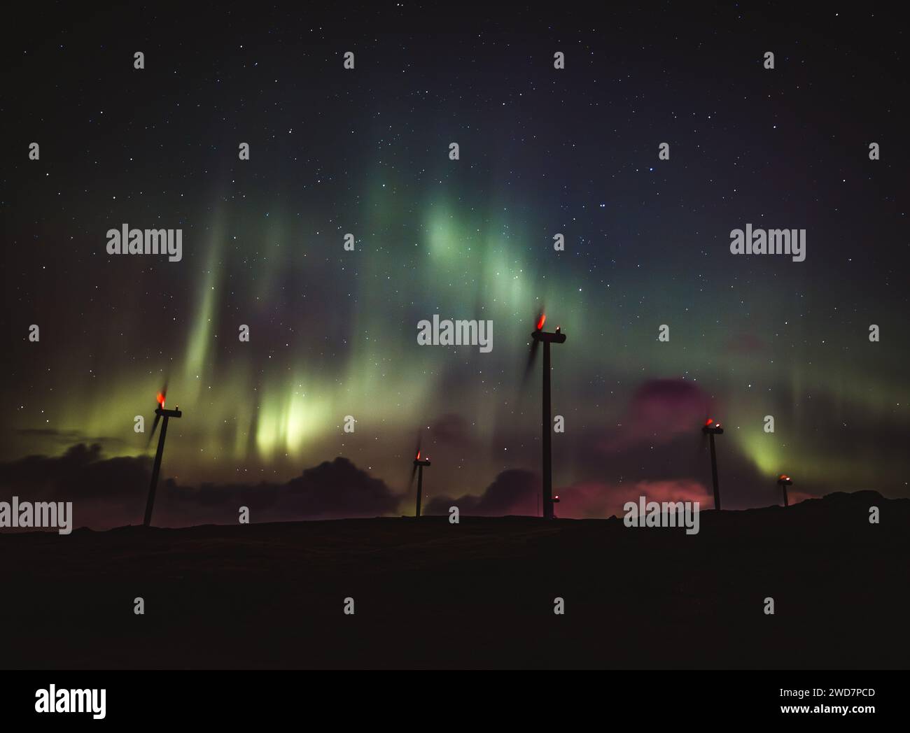 Renewable energy wind turbines and northern lights at night Stock Photo ...