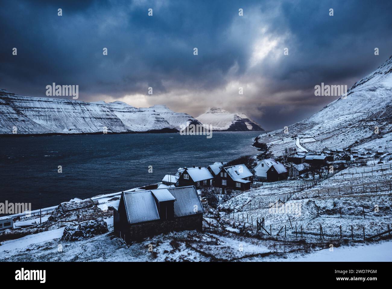 Village of Kunoy, Faroe Islands in the snow with clearing storm Stock ...
