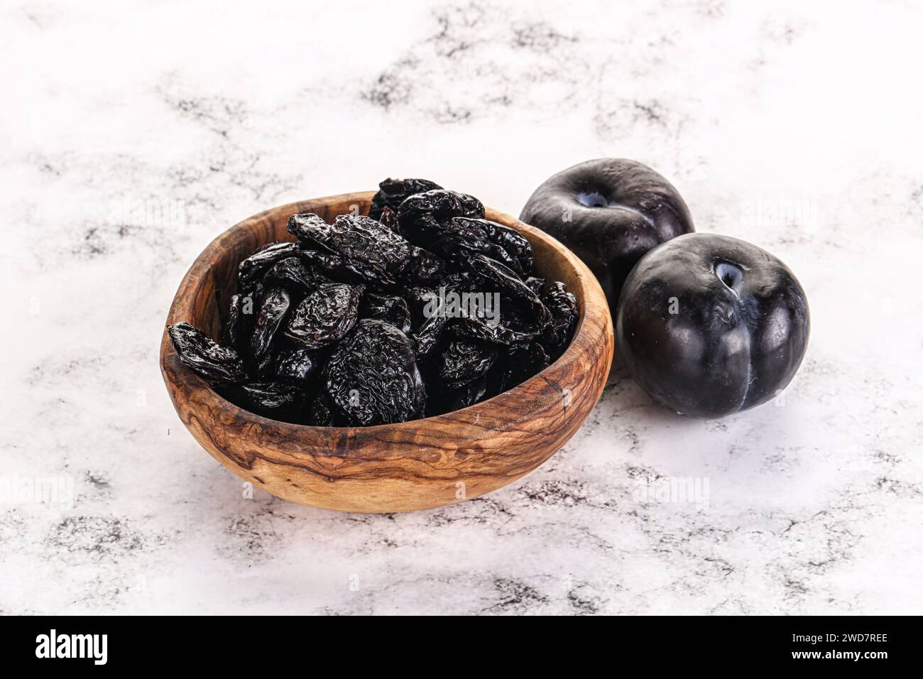 Dry sweet prunes in thw bowl Stock Photo - Alamy