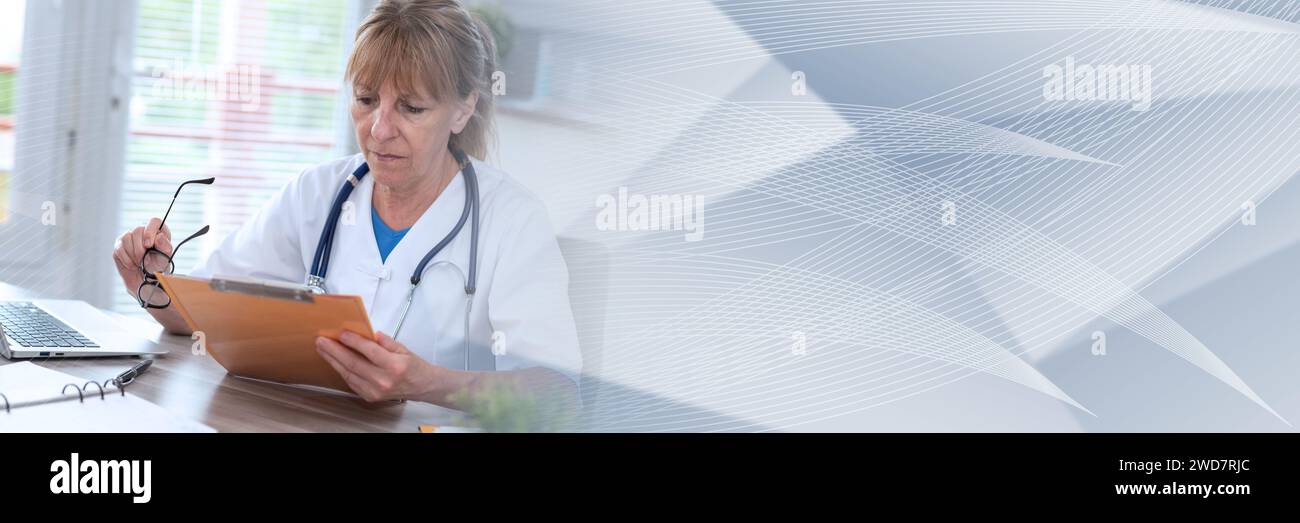 Female doctor reading a clinical record in medical office; panoramic ...