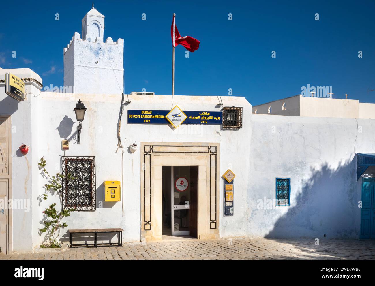 A Tunisian flag flies over the ancient building housing the post office ...