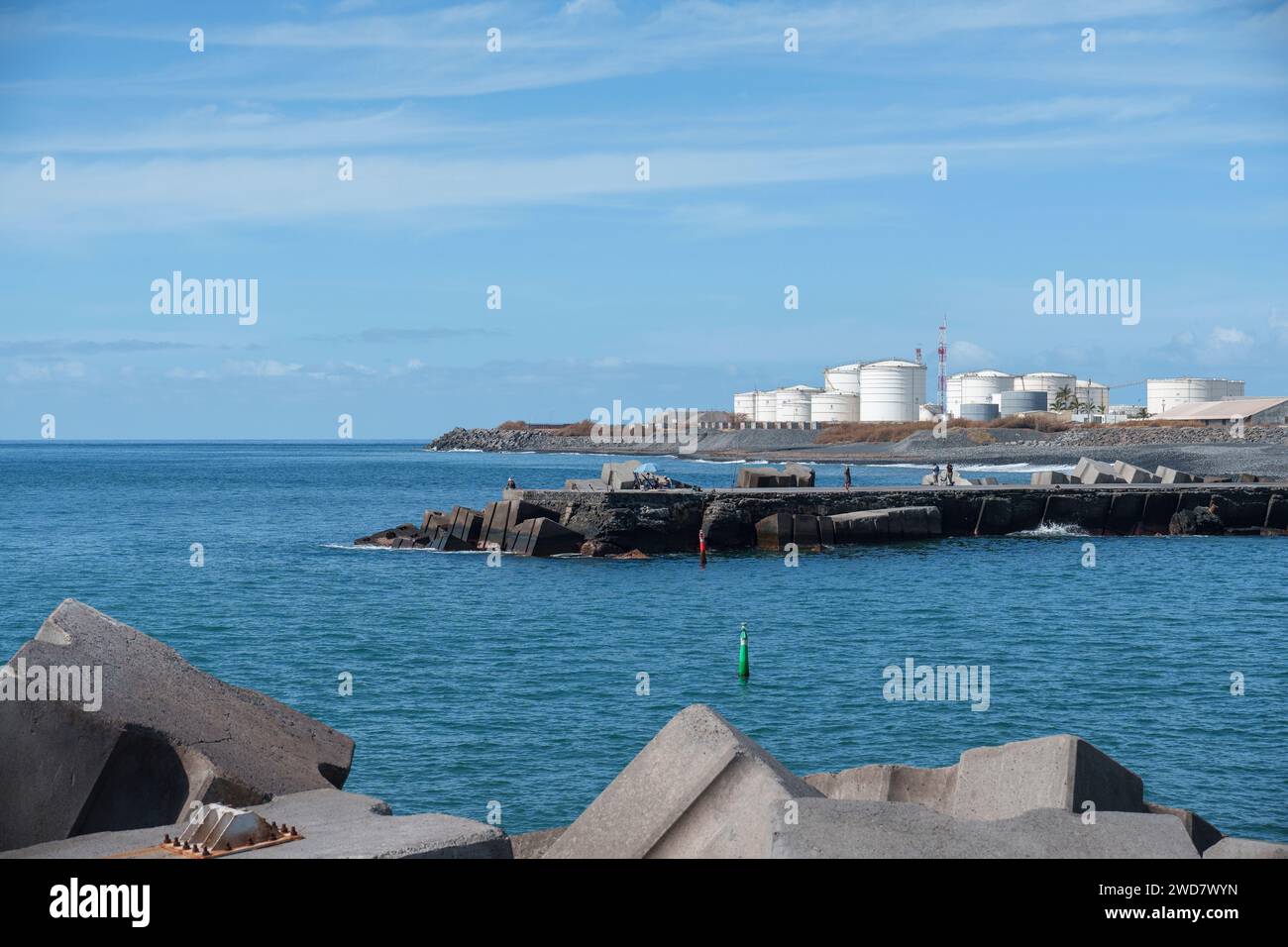 A view of the entrance to the port in the town of Le Port, Reunion ...