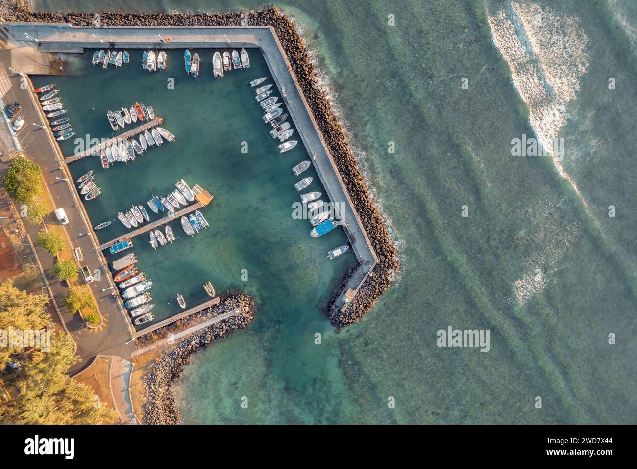 An aerial view of a marina. This is the port of Saint-Leu on Reunion ...