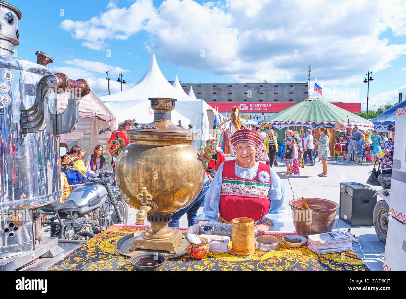 Traditional Irbit fair, Russia.Senior woman in festive folk clothes ...