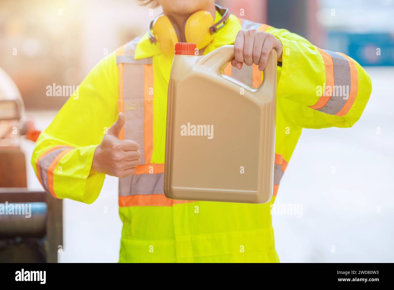 Engineer worker show Engine lube oil plastic bottle gallon hand thumb ...