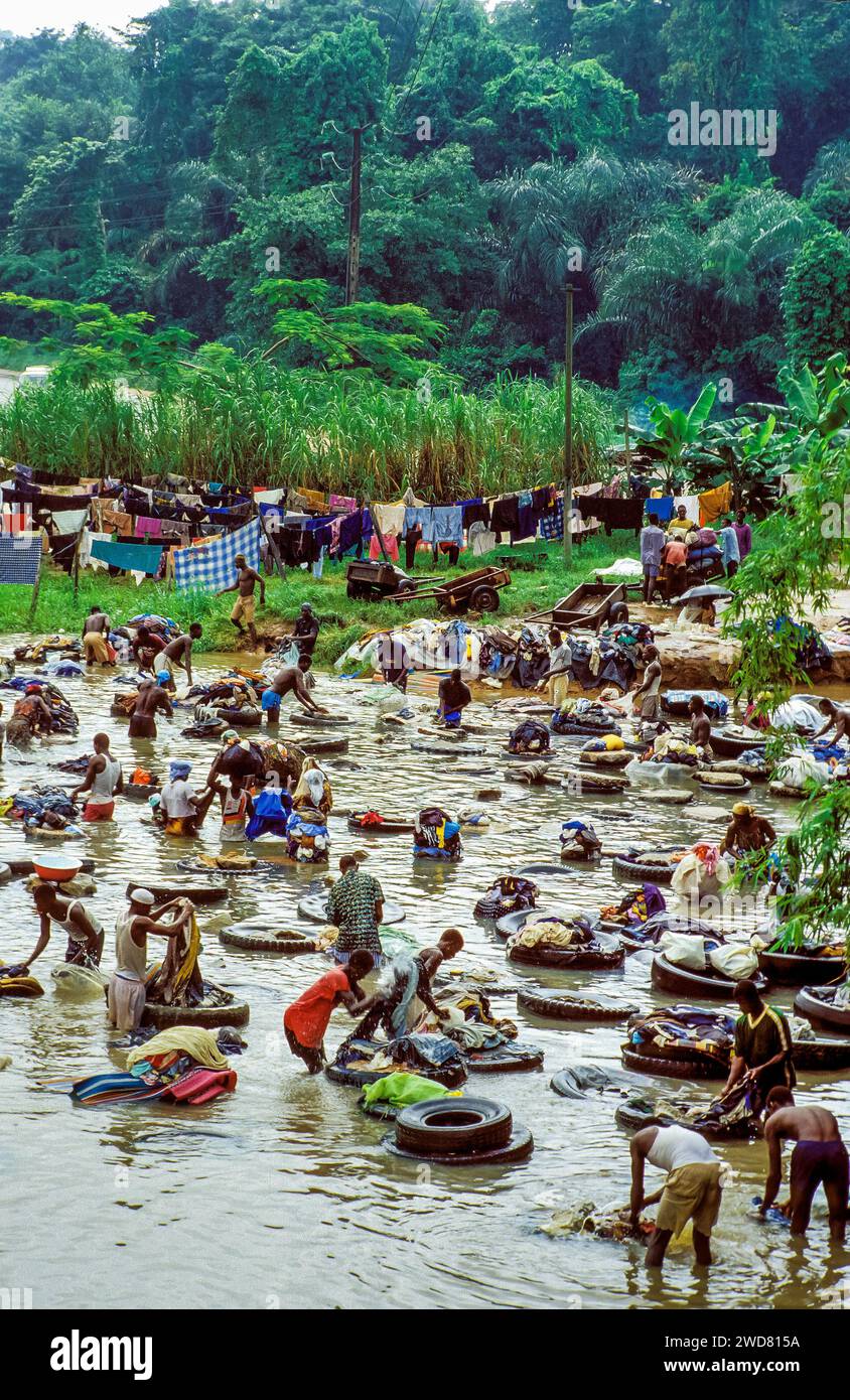 Ivory Coast, outside Abidjan people are hand washing the laundry in a ...
