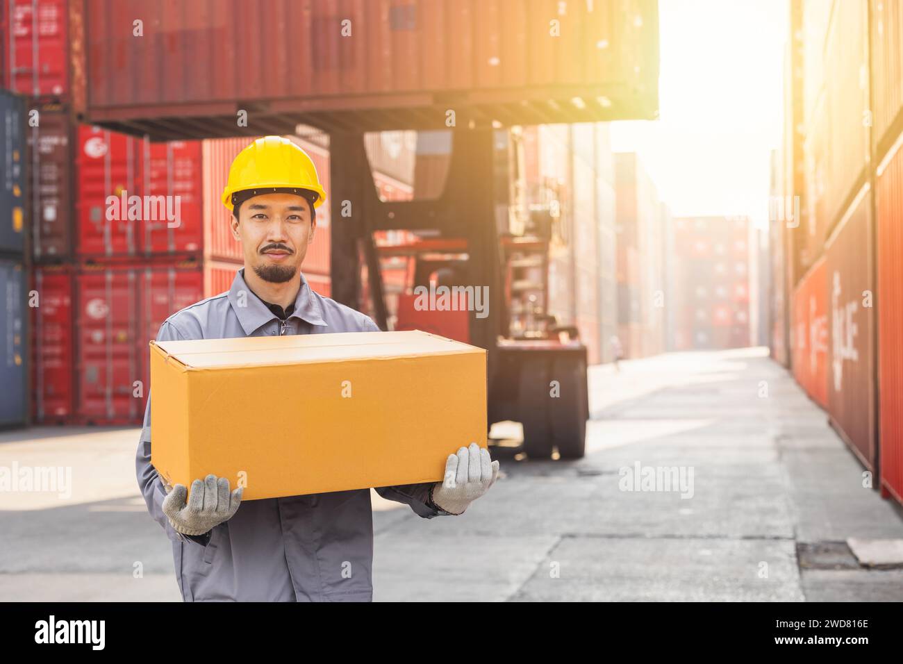 Japanese male smart worker working in container port cargo. Japan ...