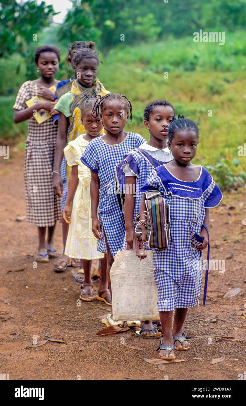 Ivory Coast, Divo Girls on their way to school walking in line Stock ...