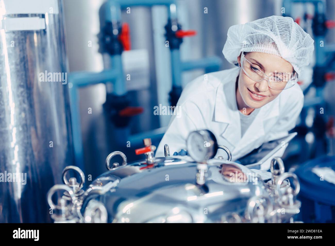 staff work in science medical lab factory check record pressure tank ...