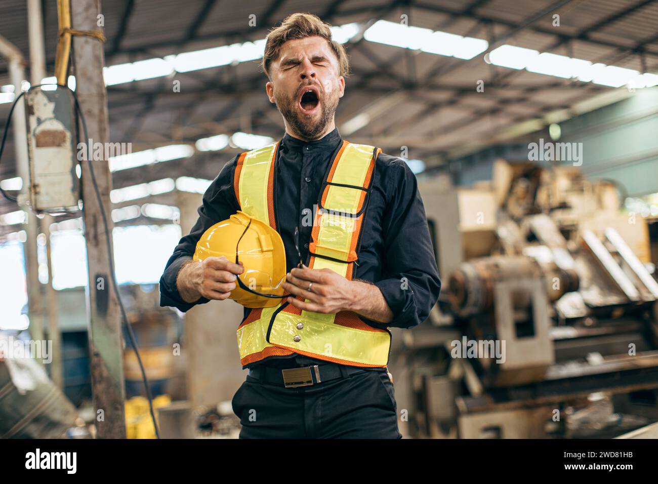 lazy sleepy yawning engineer industry worker tired fatigue from hard work and sleep late or ...