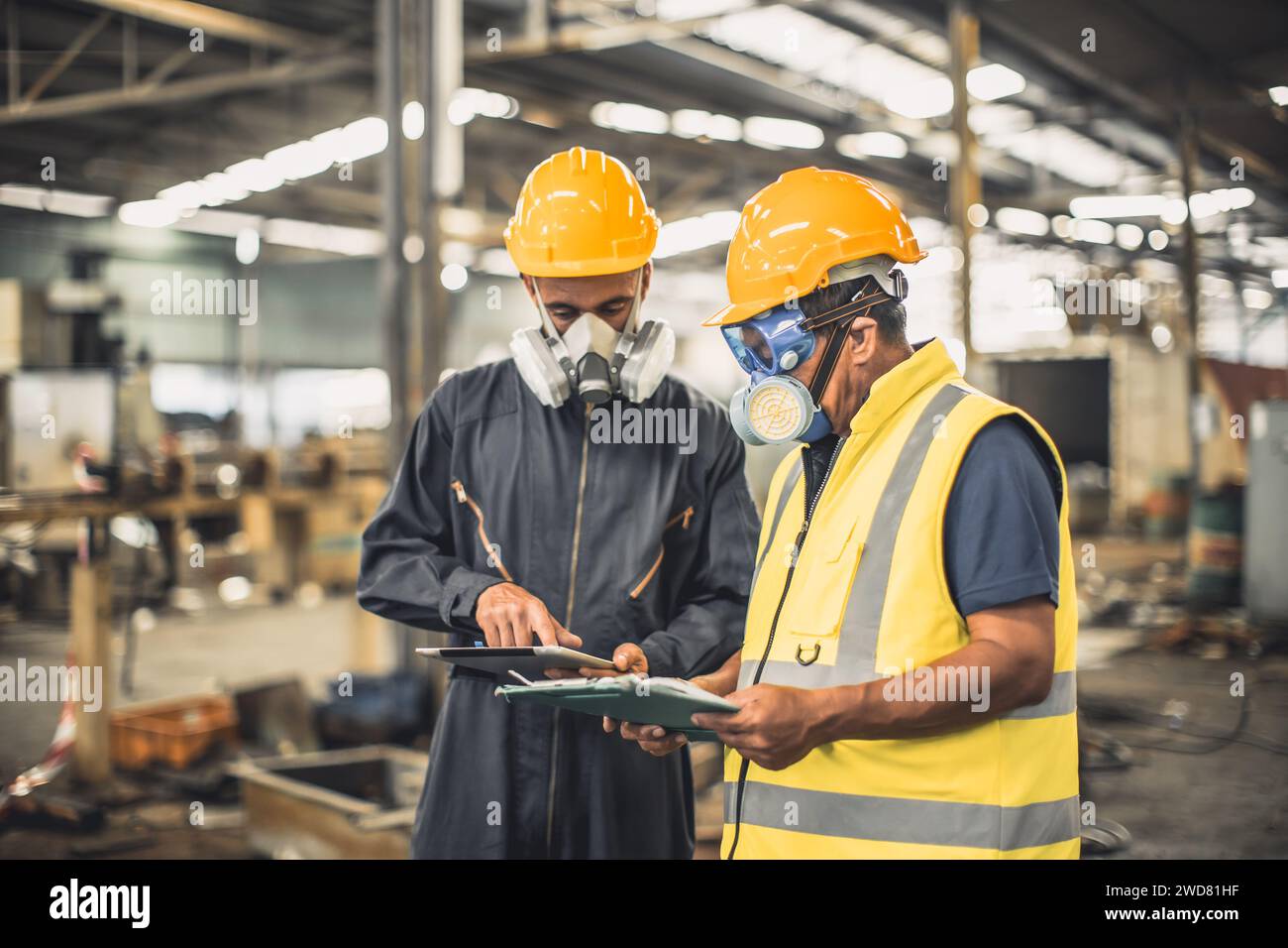 Toxic chemical gas leak safety team working cleaning in danger factory ...
