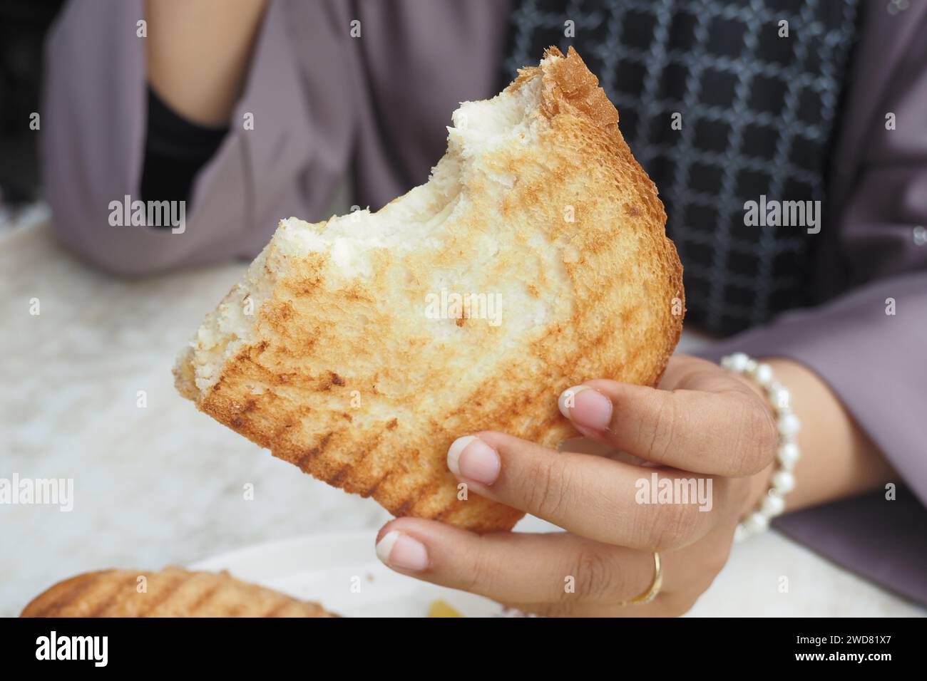 Women hand pick sandwich hi-res stock photography and images - Alamy