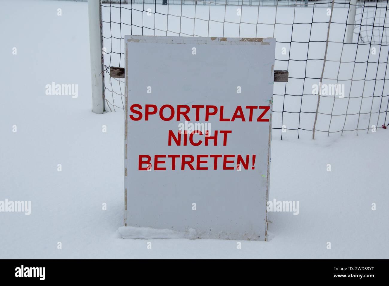 Symbol image of a football match cancelled due to snow. Sign on a ...