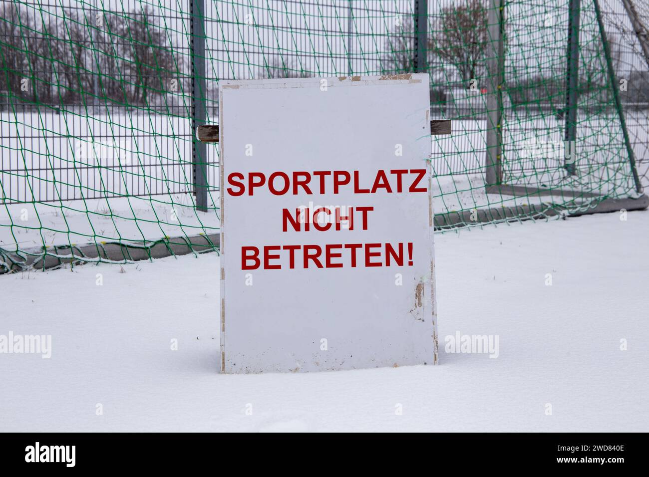 Symbol image of a football match cancelled due to snow. Sign on a ...