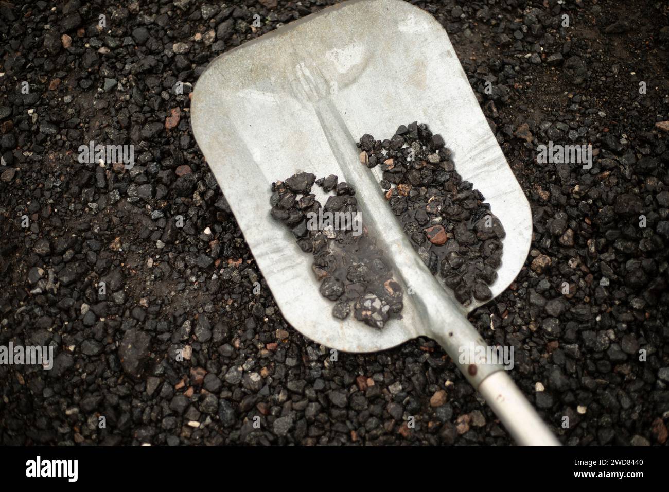 The shovel lies on the gravel. Steel shovel. Small crushed stone. Tool ...
