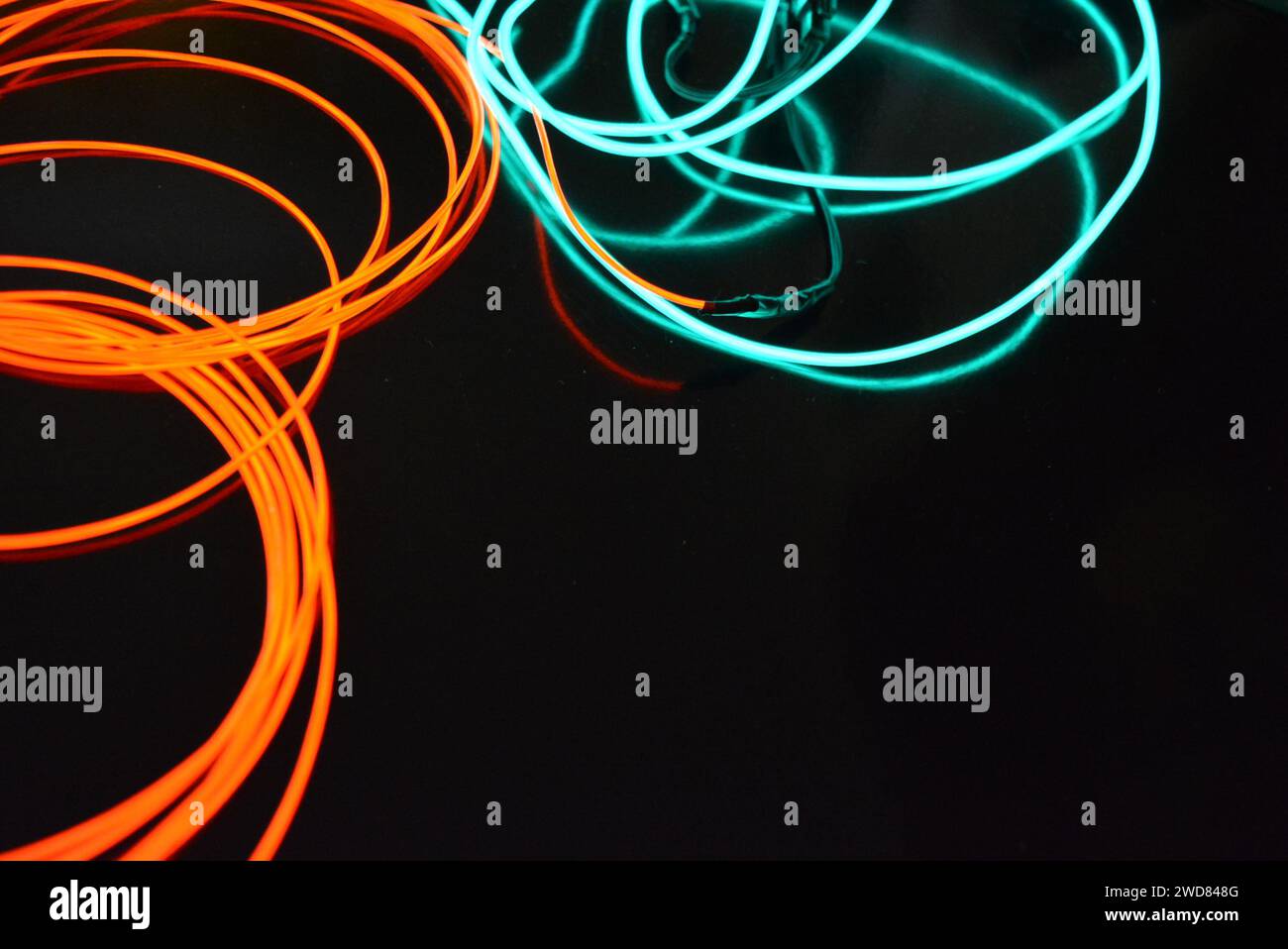 Neon green, blue and red thin wire. Luminous wires, decoration and ...