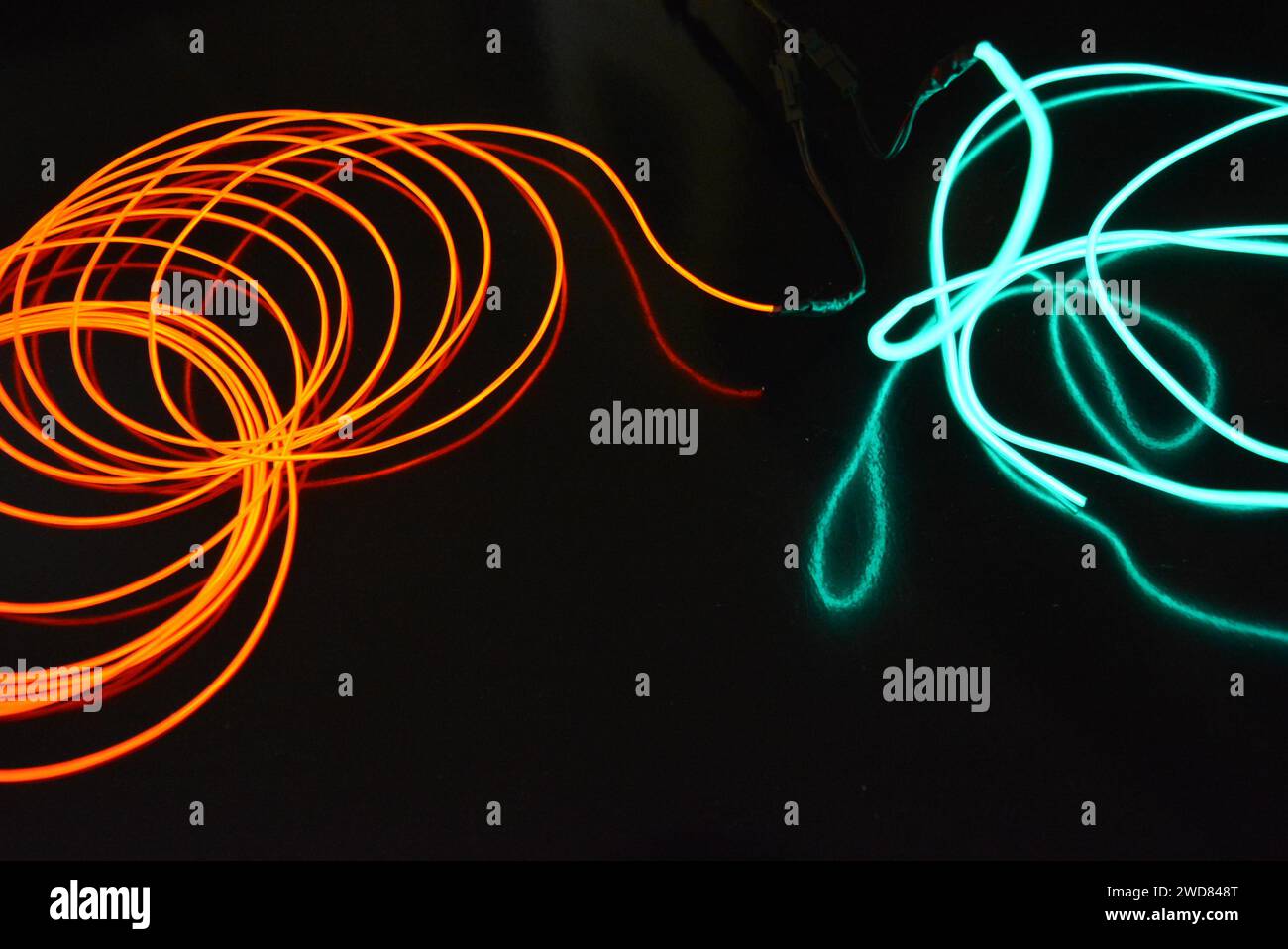 Neon green, blue and red thin wire. Luminous wires, decoration and ...