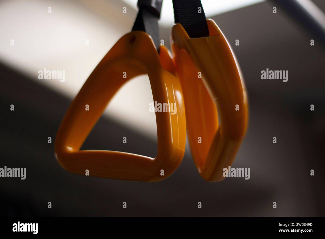 Handrail in the bus. Handrail for the hand in transport. Yellow handle ...