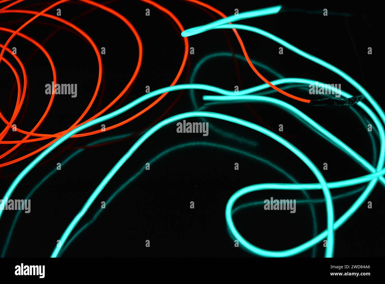 Neon green, blue and red thin wire. Luminous wires, decoration and ...