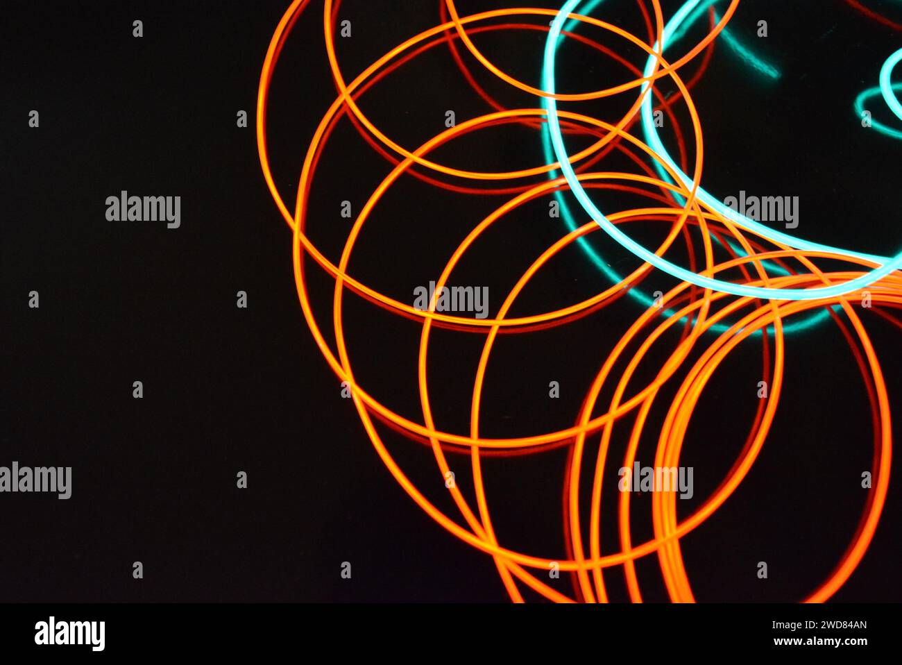 Neon green, blue and red thin wire. Luminous wires, decoration and ...