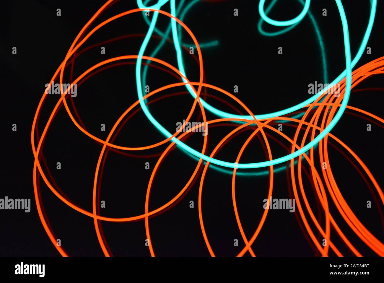 Neon green, blue and red thin wire. Luminous wires, decoration and ...