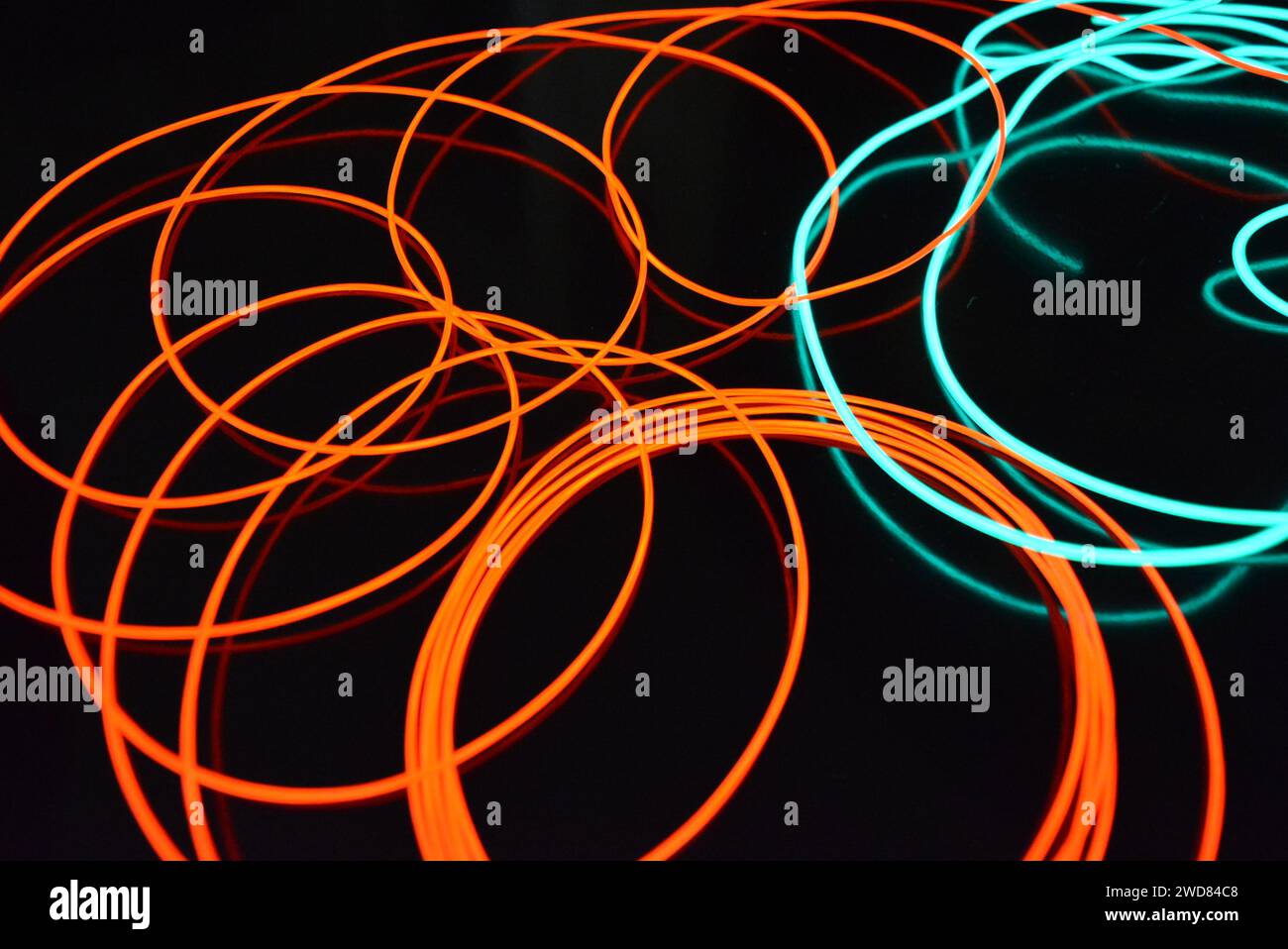 Neon green, blue and red thin wire. Luminous wires, decoration and ...