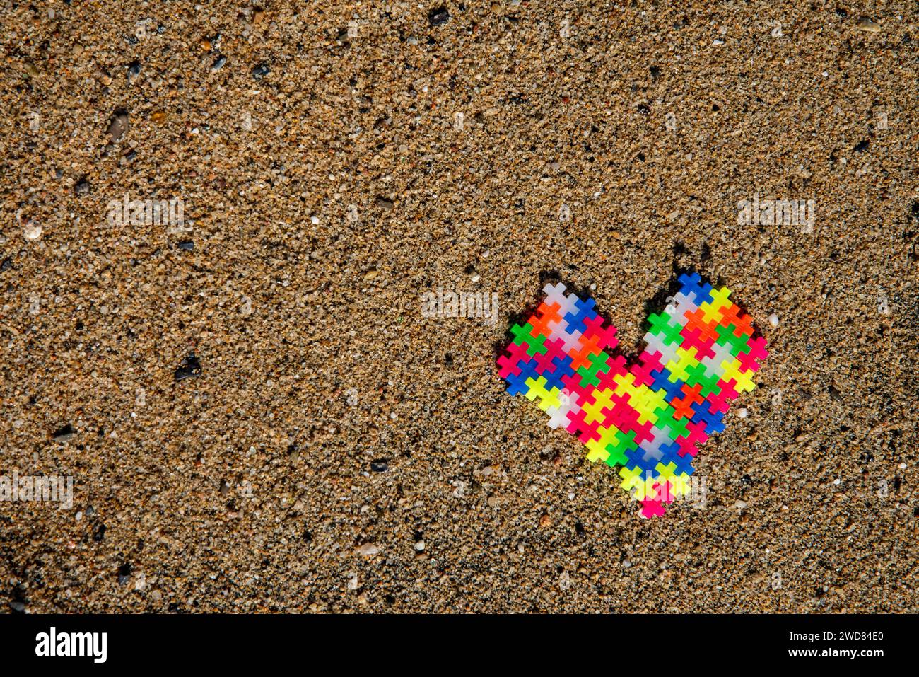 Puzzle heart: Love and connection depicted by colorful puzzle pieces on ...