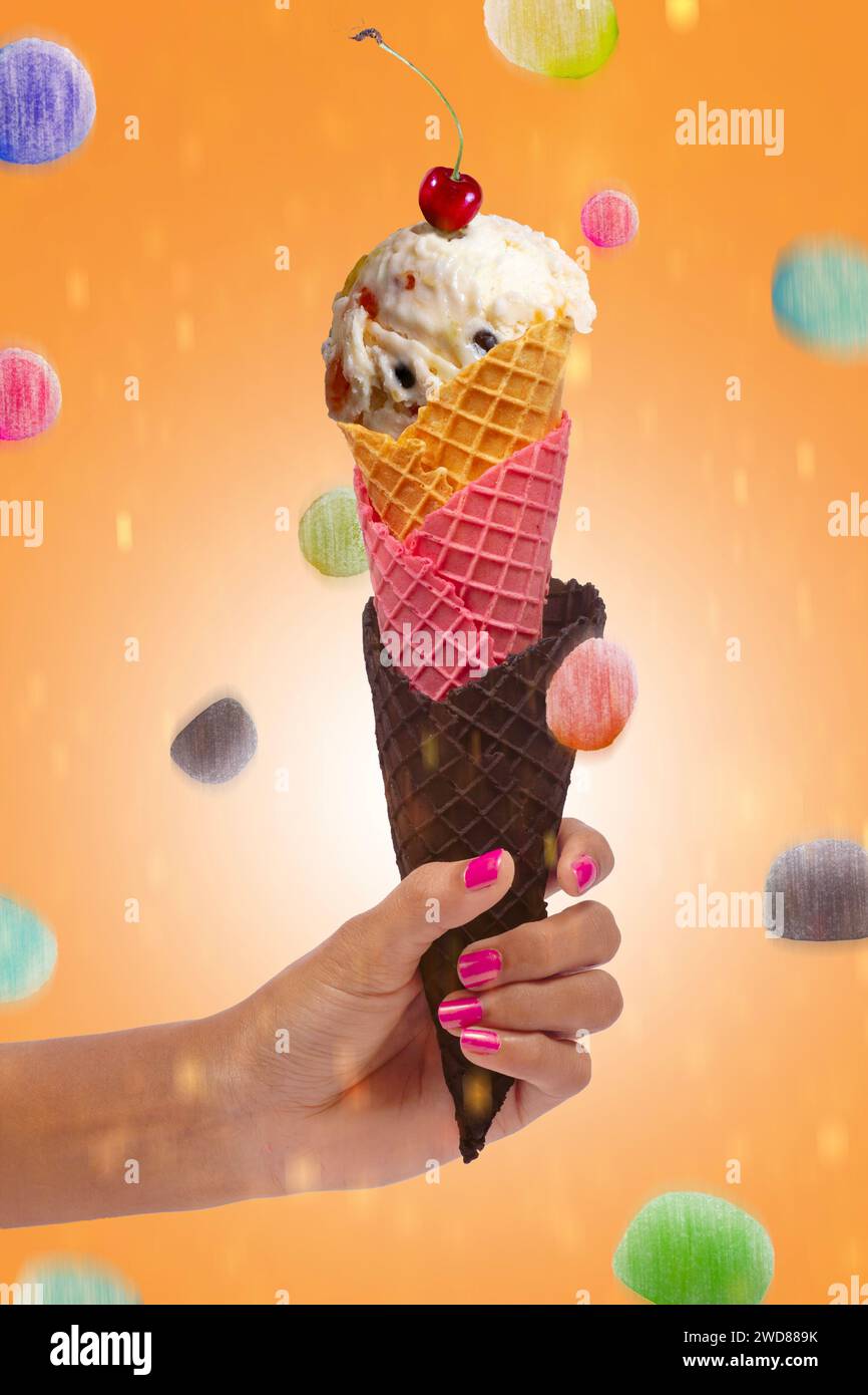 Woman's hand holding vanilla jelly ice cream cone. Ice cream cone in ...