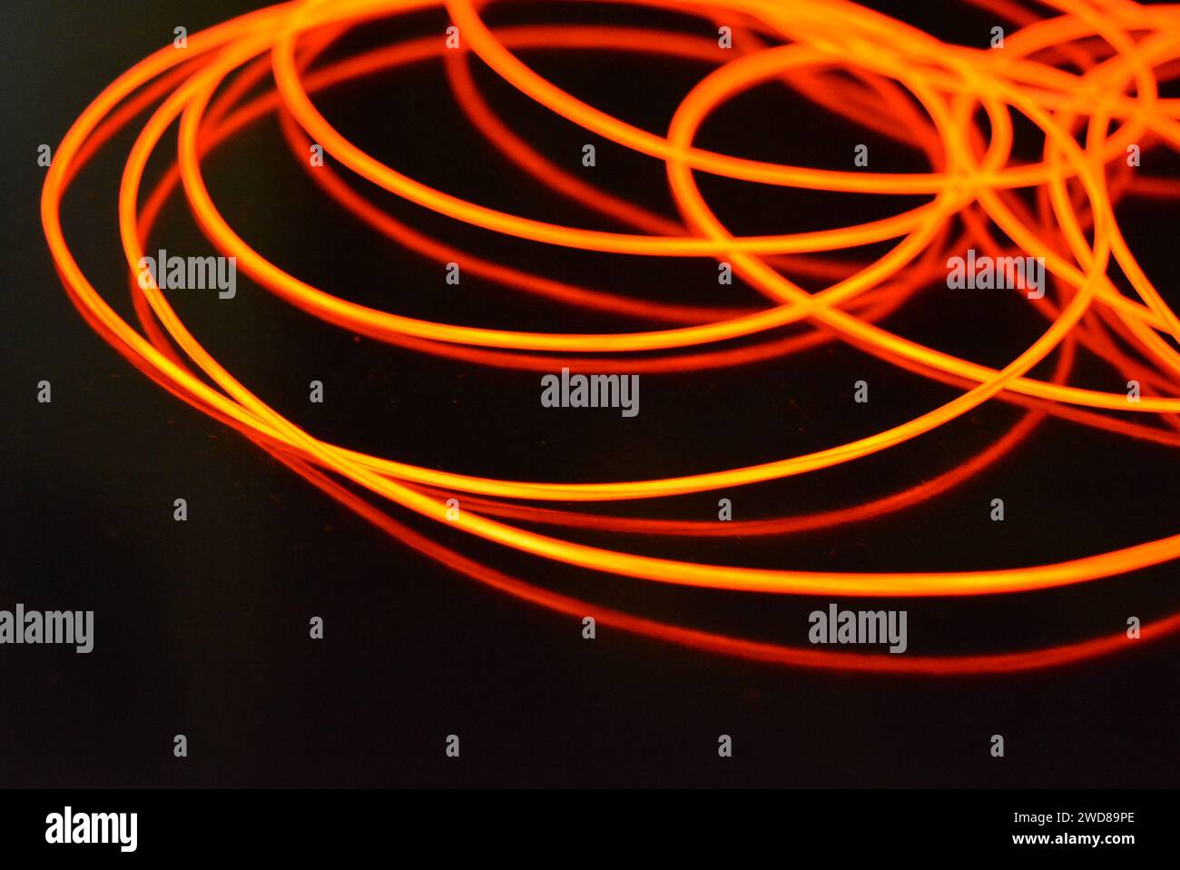 Glowing red material, thin bright threads. Art abstraction fiber ...