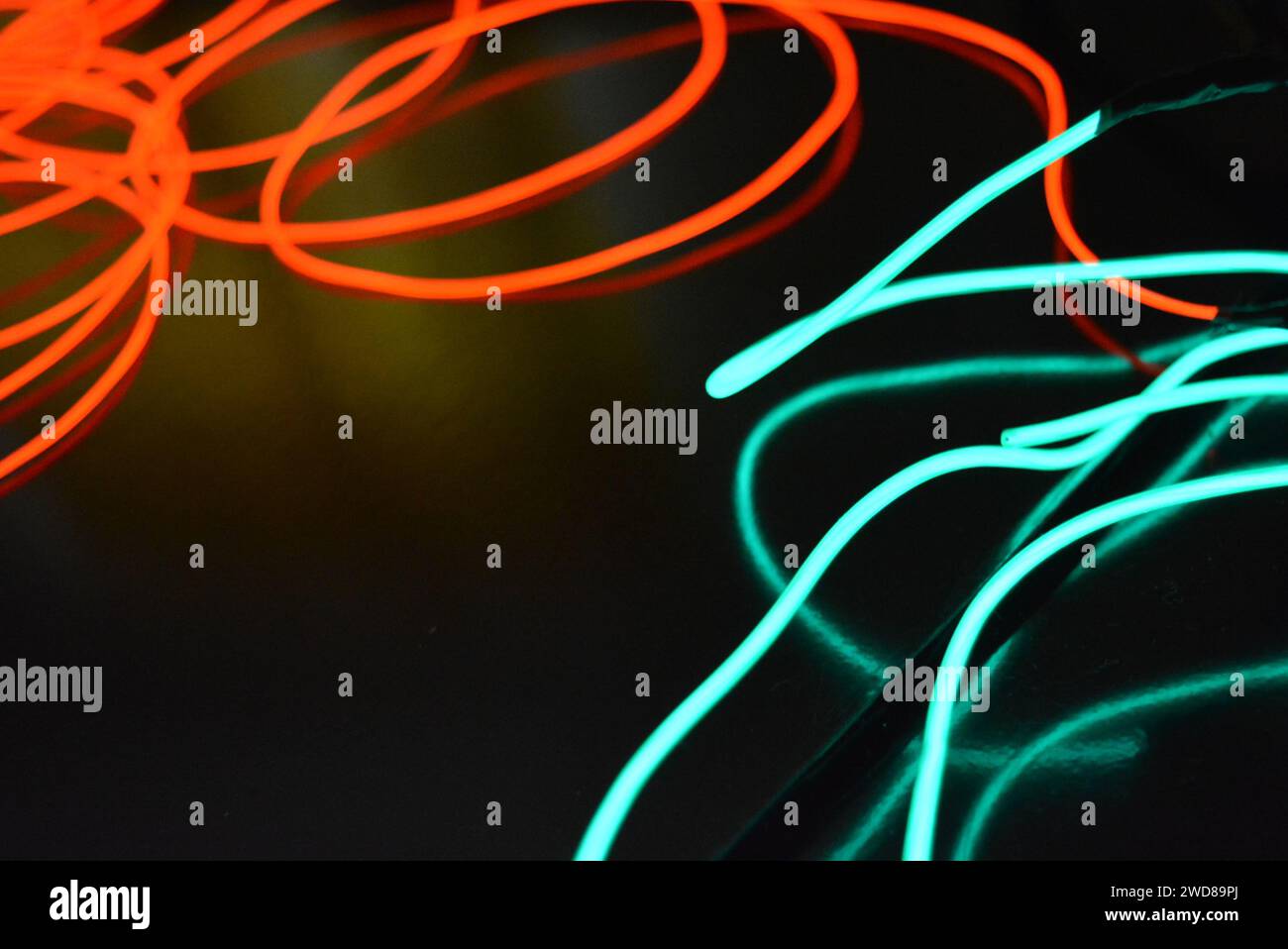 Neon green, blue and red thin wire. Luminous wires, decoration and ...