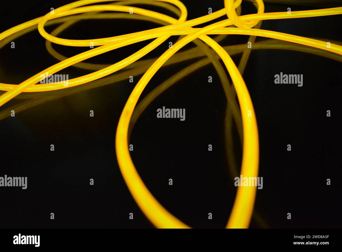 Original yellow lighting of thick electoluminescent wires and lines ...