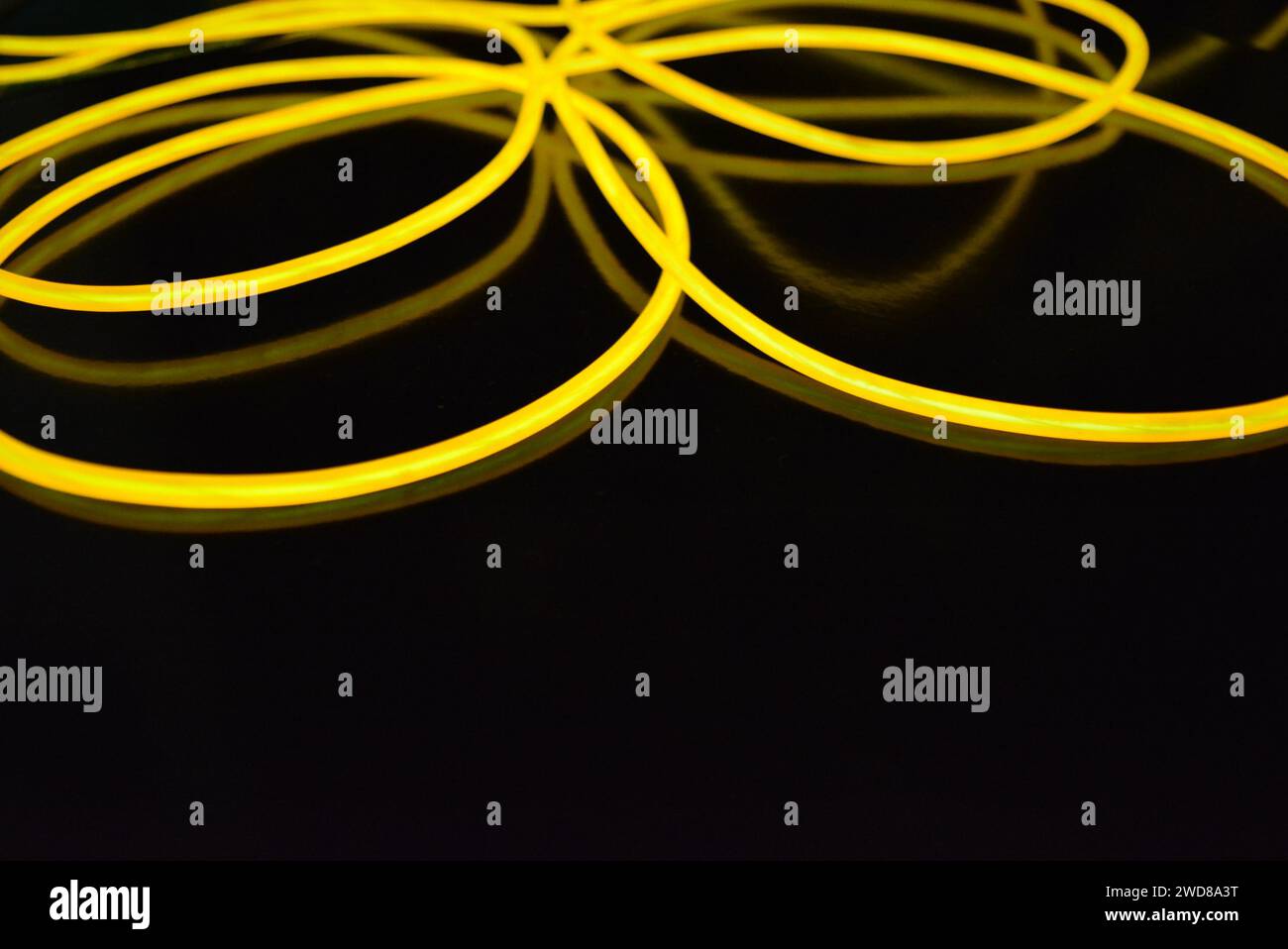 Original yellow lighting of thick electoluminescent wires and lines ...