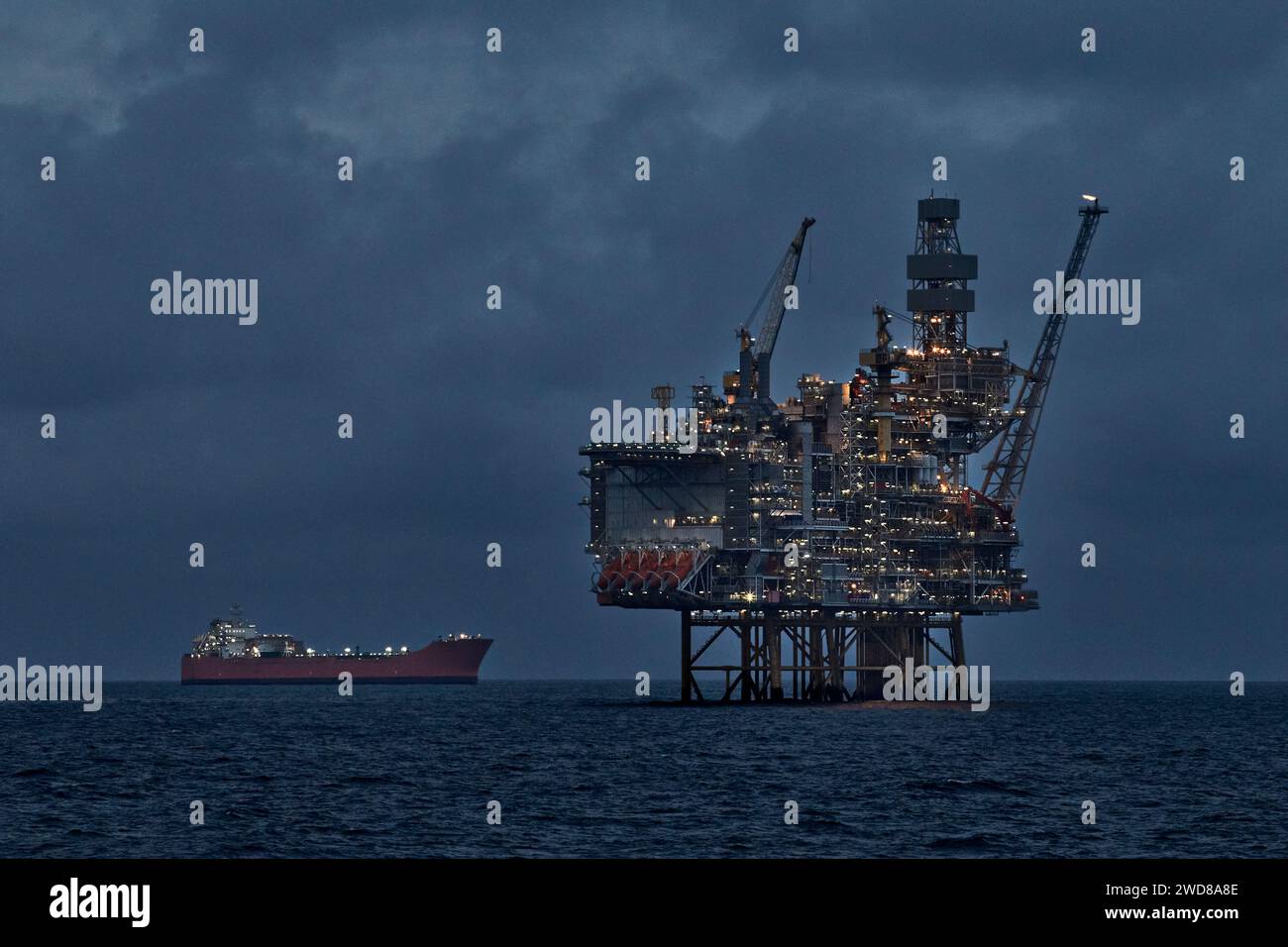 Crude oil production in the sea with jackup drilling rig and floating ...