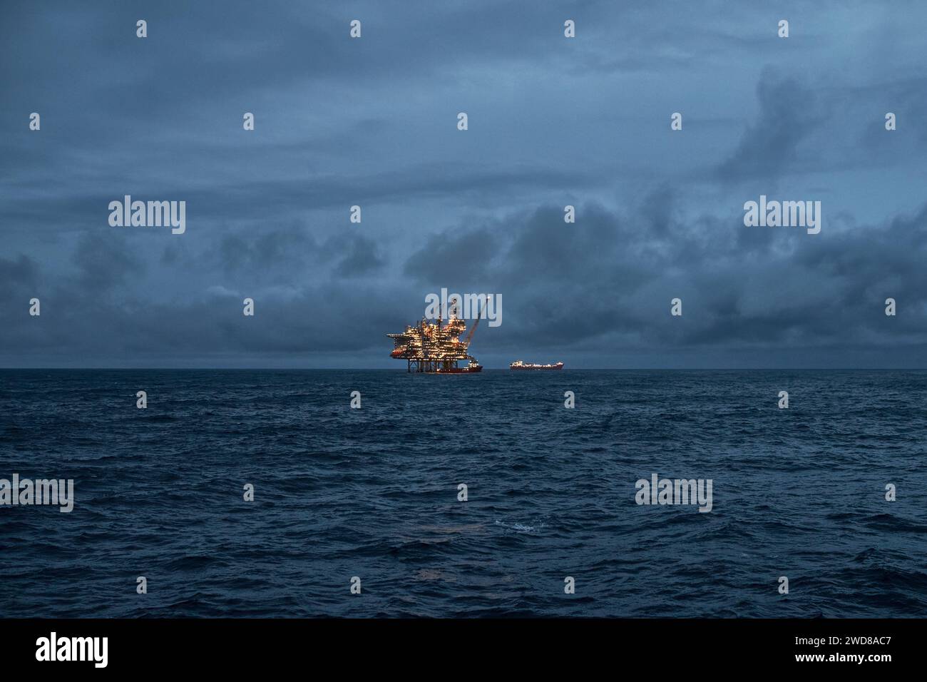 Panoramic view of offshore oil filed in the sea, early in the morning ...