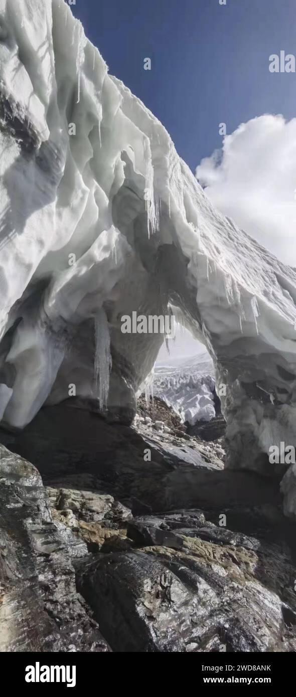Ice cave in snowy mountains hi-res stock photography and images - Alamy