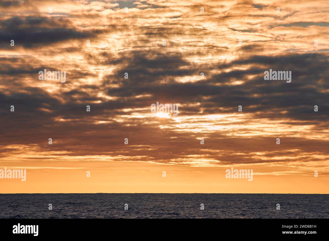Beautiful colourful sunset sky with yellow clouds in the sea Stock ...