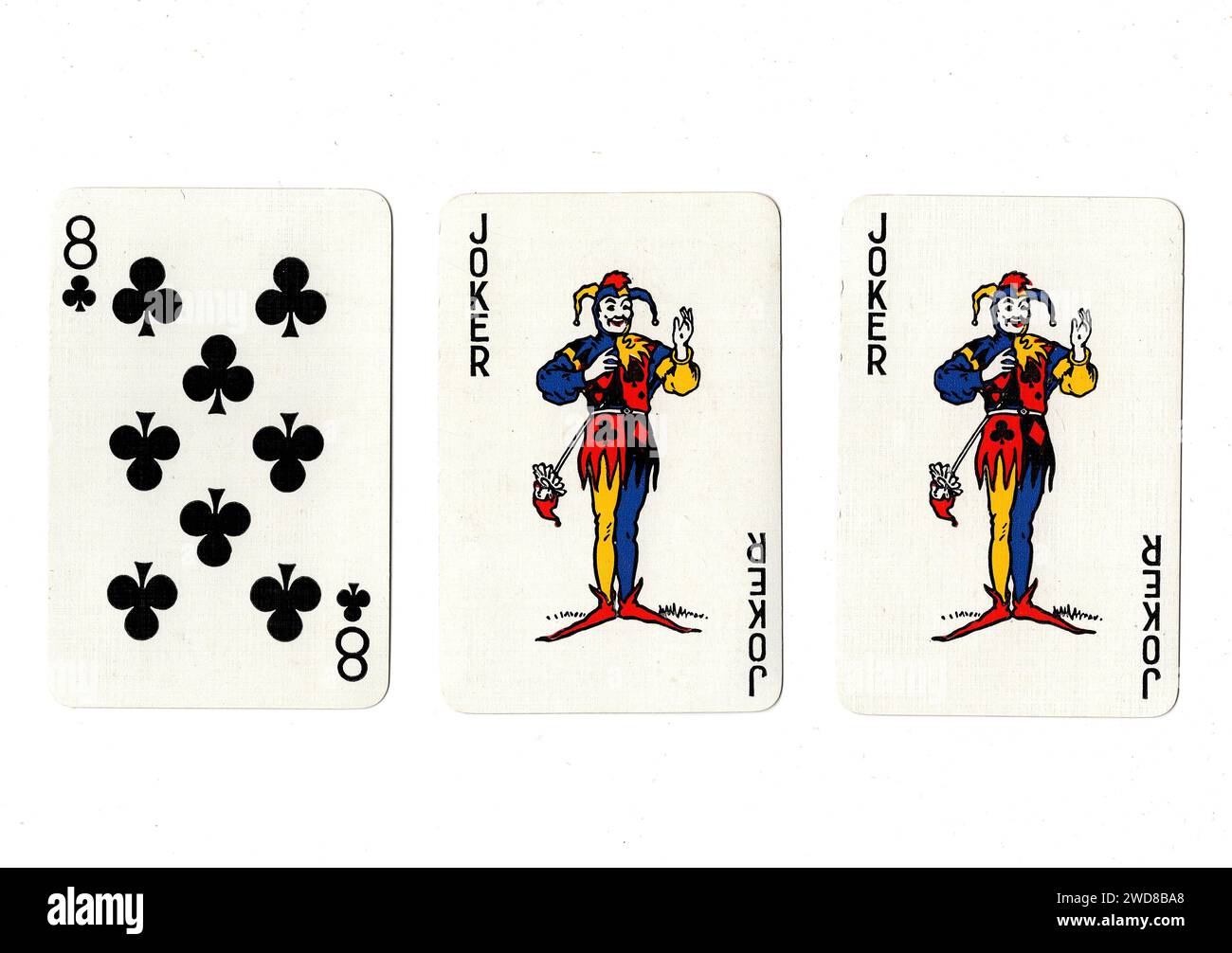 Vintage playing cards showing a pair of jokers and a black eight ...