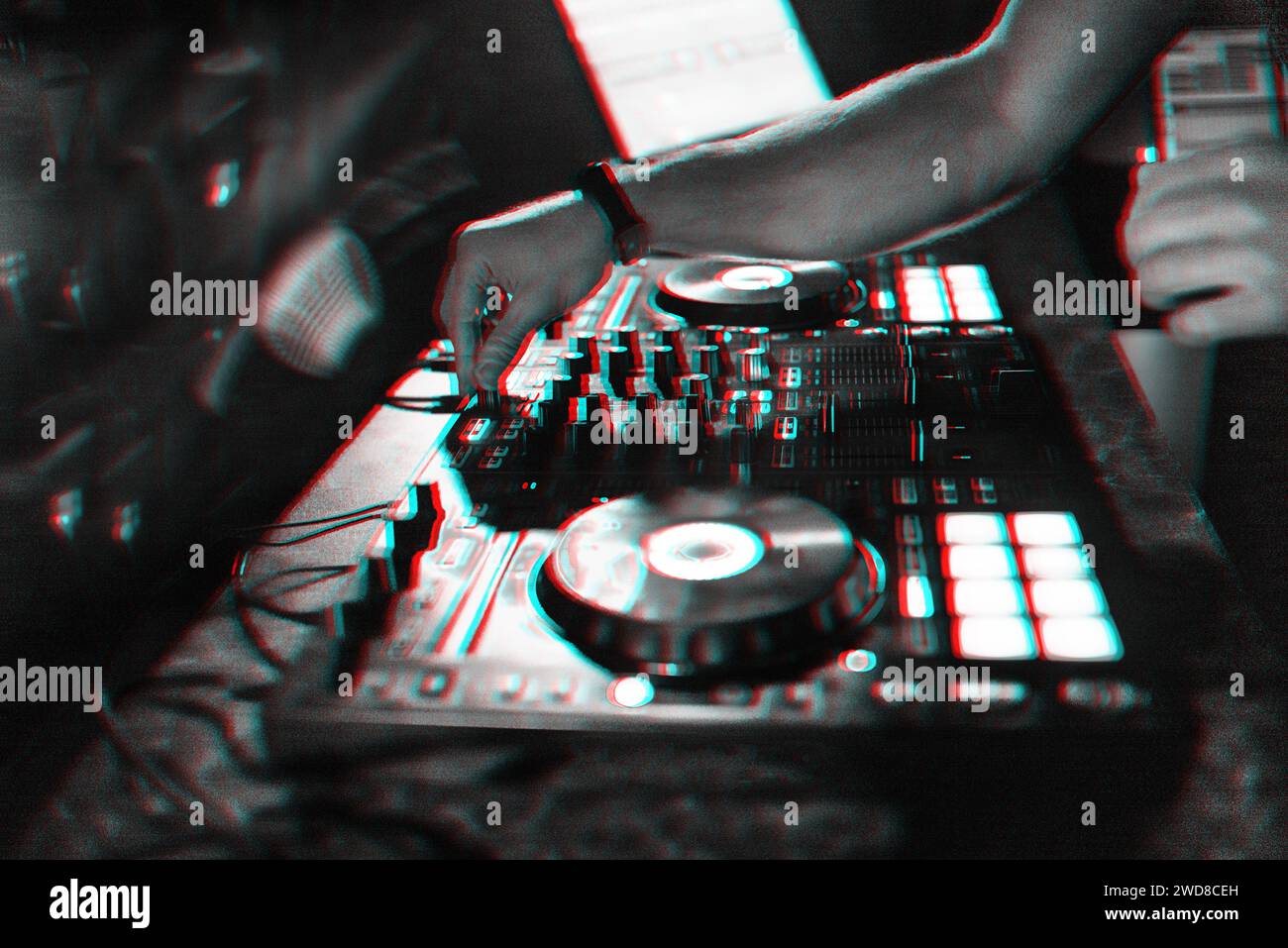 hands DJ playing electronic contemporary music on the mixer console at ...