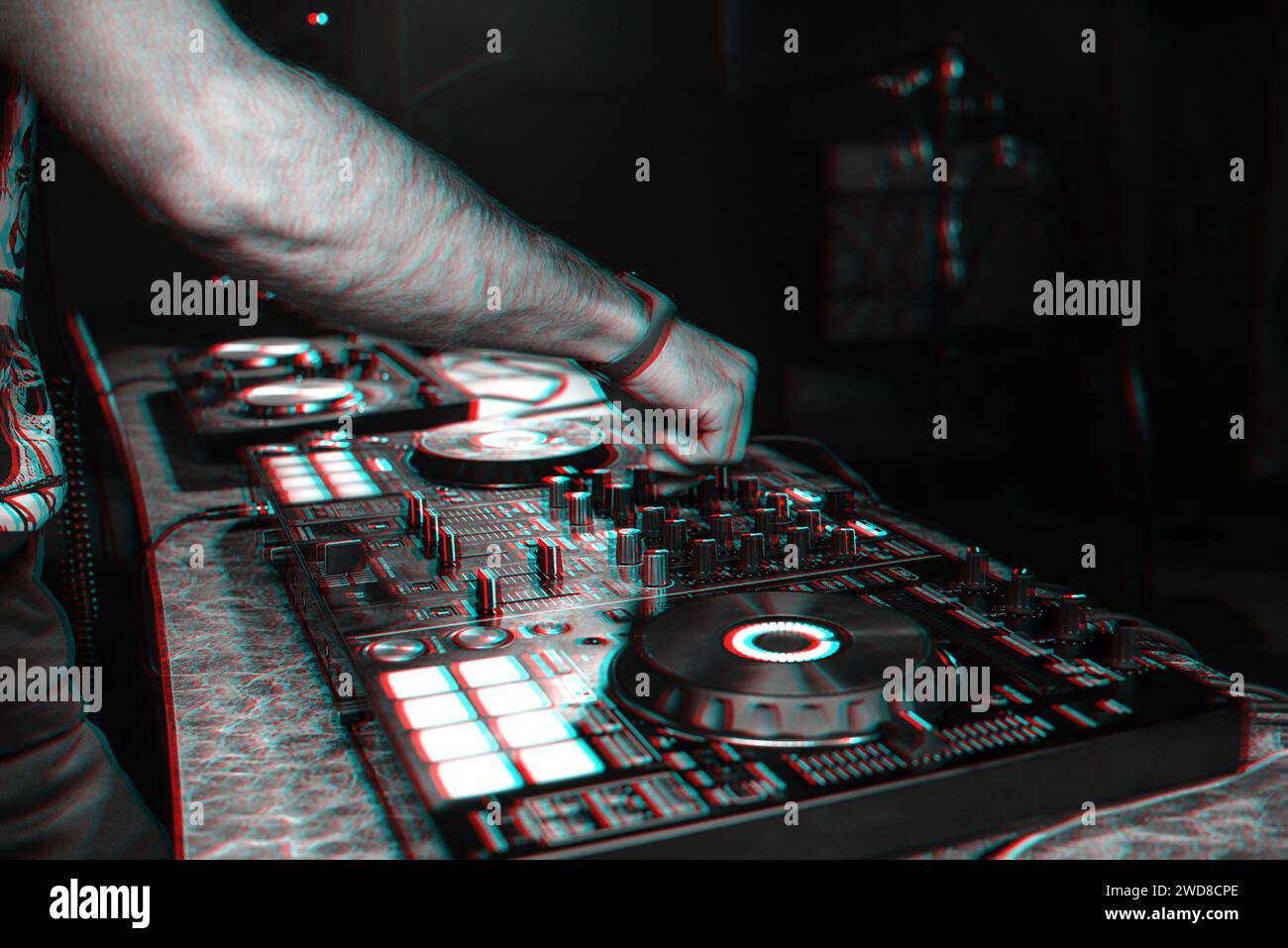 hands DJ playing electronic contemporary music on the mixer console at ...