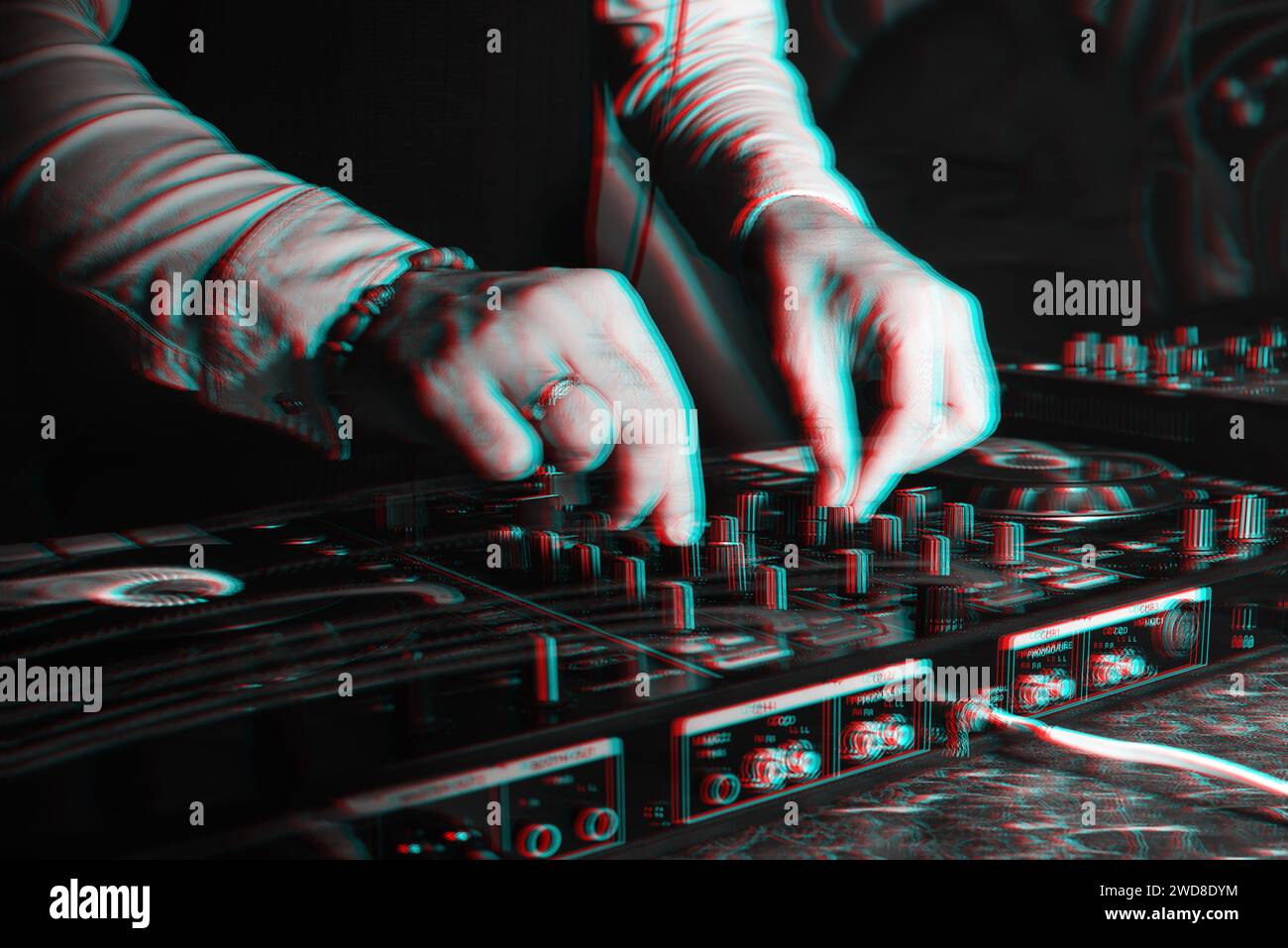 DJ in the booth playing in a nightclub on the background of the mixer ...